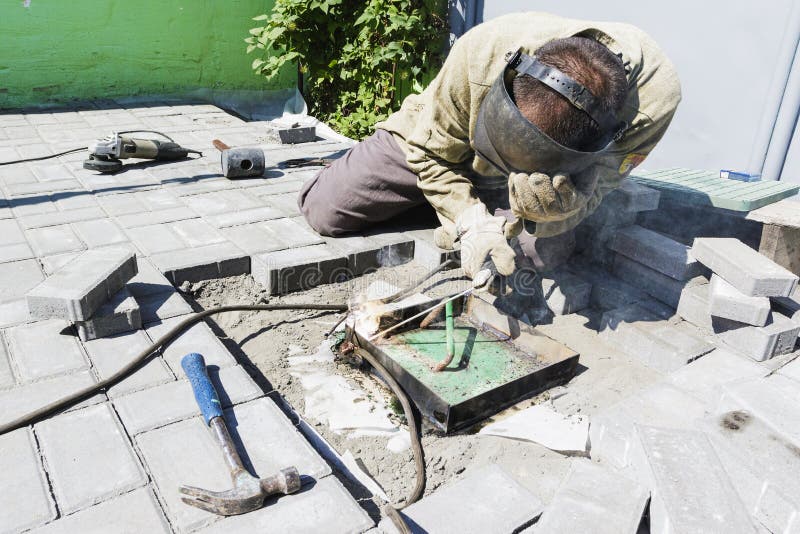 The Welder Performs Welding Works. Stock Image - Image of boilersuit ...