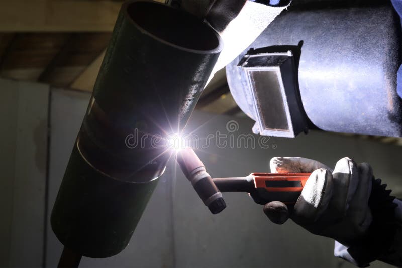 The Welder is Welding To Pipe for Welder Qualification with Gas ...