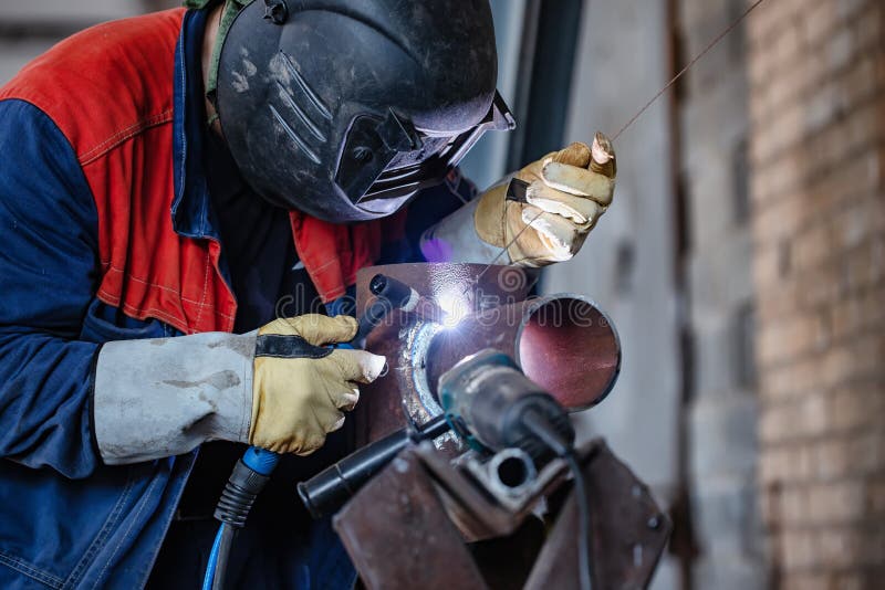 Welder in the Shop Weld Sample from the Tube for Passing of ...