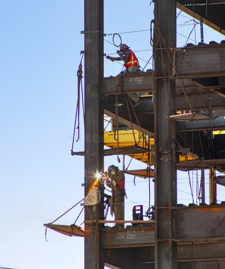 Welder on a Steel Beam Framed Building at a Construction Site Stock ...