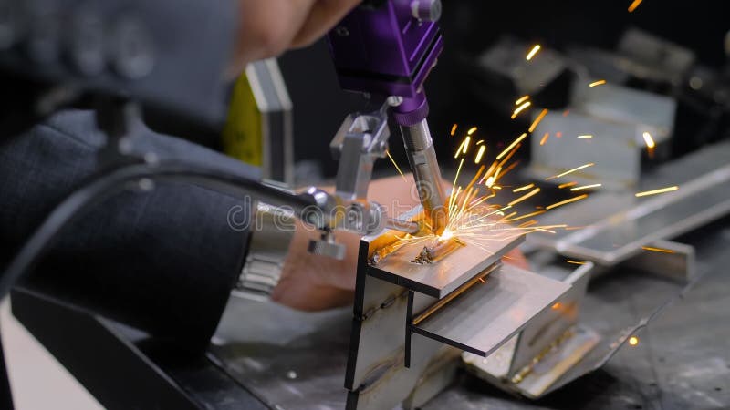 Welder is Using Portable Handheld Laser Welding Machine - Close Up ...