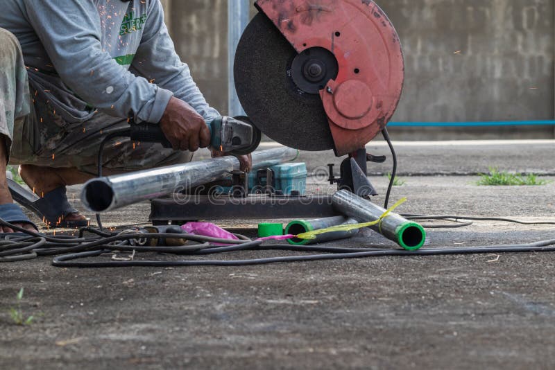 A Welder is Using a Steel Cutter To Weld it Onto the Prepared Steel ...