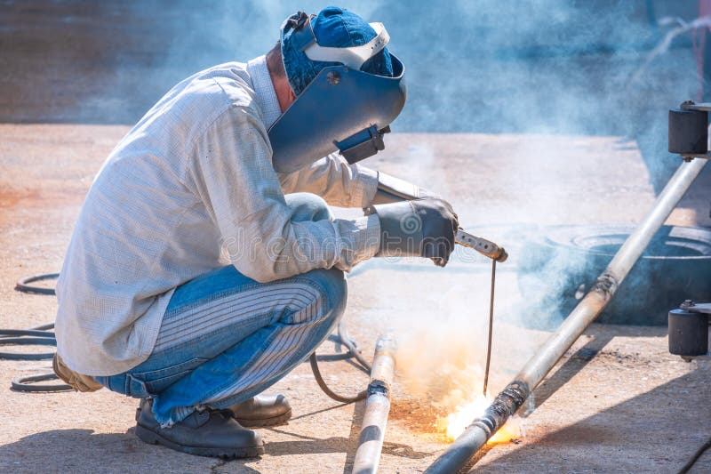Welder is Welding Galvanized Steel Pipe for Improvement Building ...