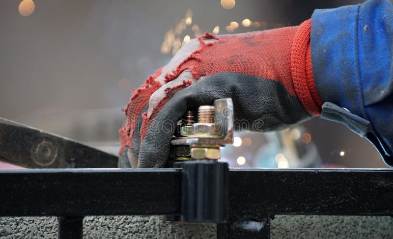 Welder is Welding Metal Part on a Construction Site Stock Image - Image ...