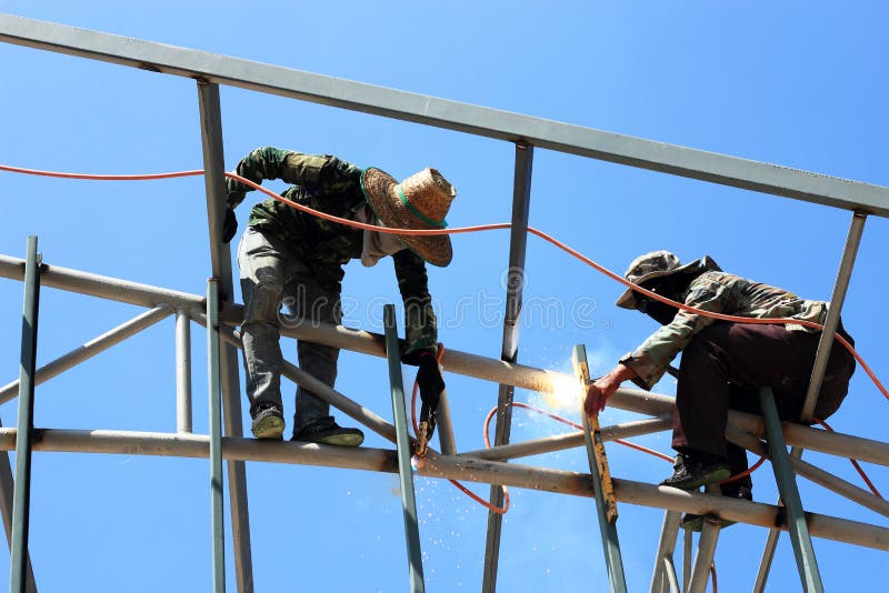 Welder Welding Metal on Roof Stock Photo - Image of build, factory ...