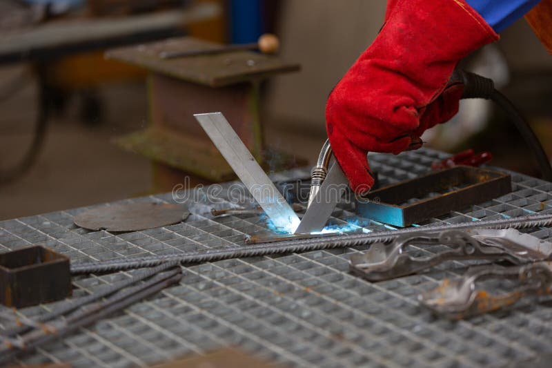 A Welder is Welding Steel Components Stock Photo - Image of light ...