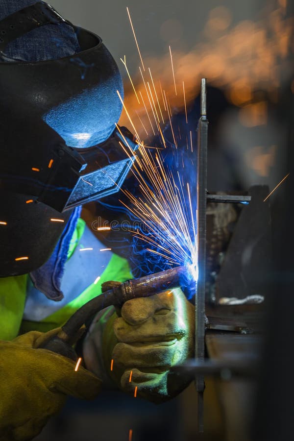 The Welder is Welding a Structural Steel with Gas Metal Arc Welding ...