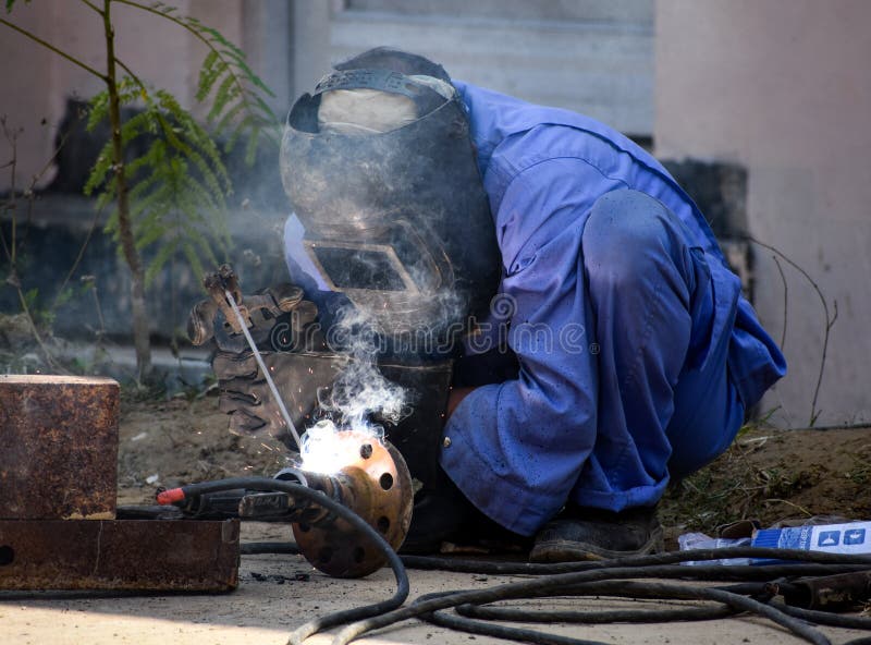 A welder welding stock image. Image of screenshot, concentration ...