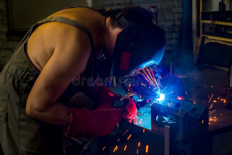 Welder for . Welding Work. Sparks Fly from Welding Stock Image - Image ...