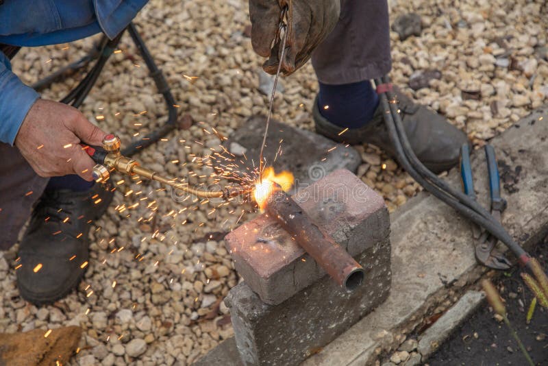 The Welder Welds a Metal Pipe. Stock Photo - Image of fire, workplace ...