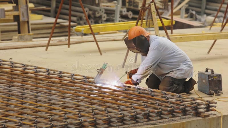 A Welder Welds a Metal Structure. Welding Metal Construction ...