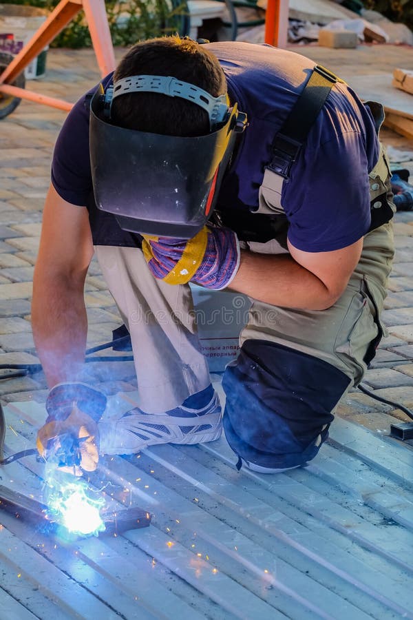 Welder Welds Steel Profile. Mounting Arc Welding Outdoors Stock Photo ...