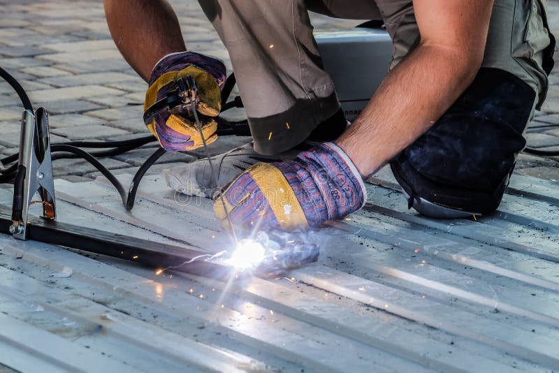 Welder Welds Steel Profile. Mounting Steel Construction Arc Welding ...