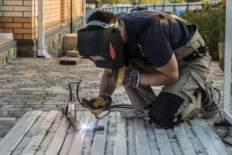 Welder Welds Steel Profile. Mounting Steel Construction Arc Welding ...