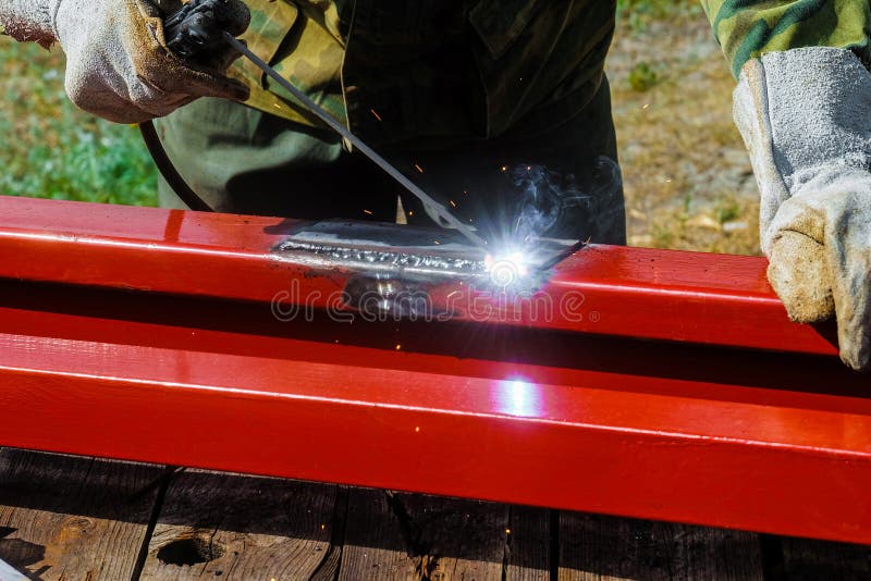 Welder Welds Steel Profile. Mounting Arc Welding Outdoors Stock Photo ...
