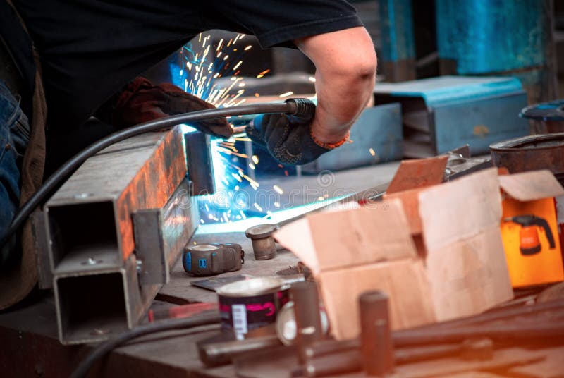 Welder Welds Two Iron Bars To Each Other Stock Image - Image of ...
