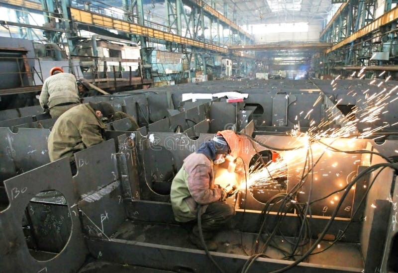 Workers in a Foundry Casting a Metal Workpiece - Safety at Work and ...