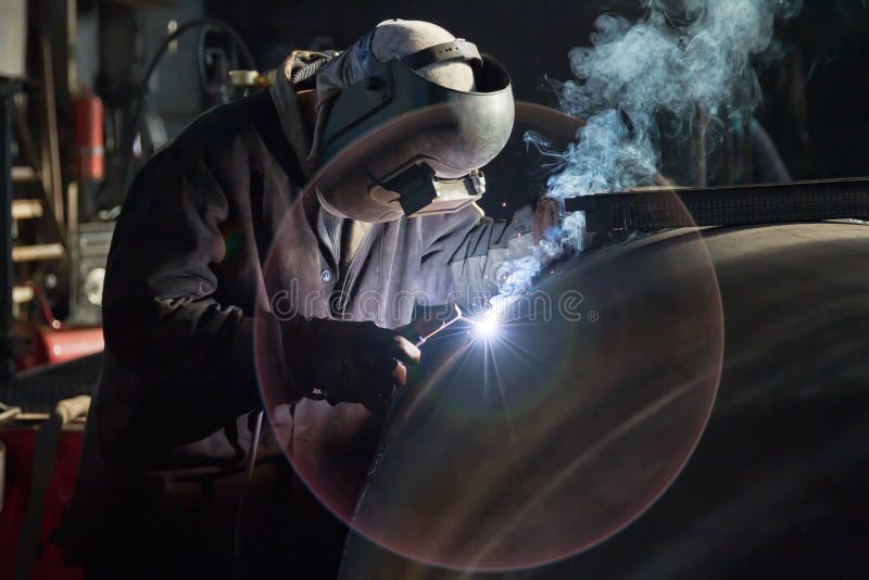 Welder at work stock photo. Image of manufacture, helmet - 56681278