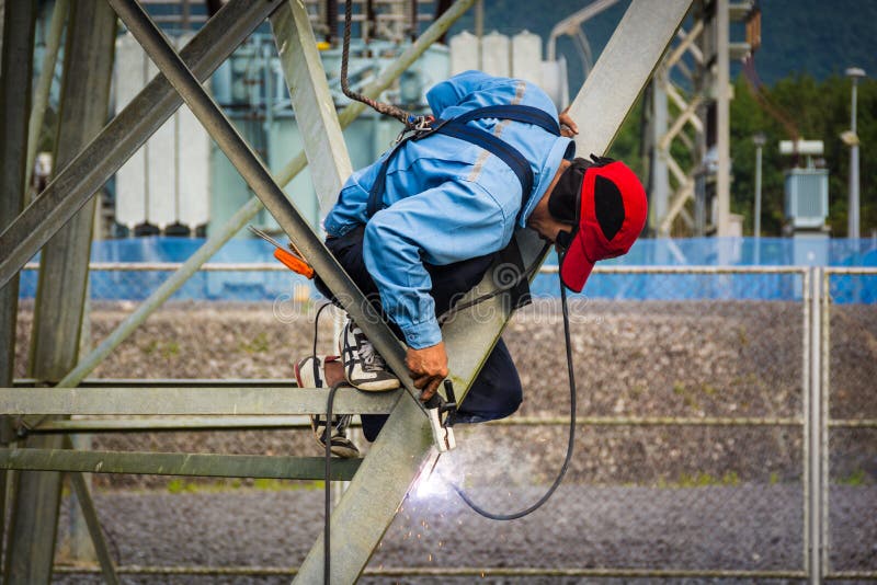 Welder Work at High Electric High Voltage Pole 230 Kv. Editorial Stock ...