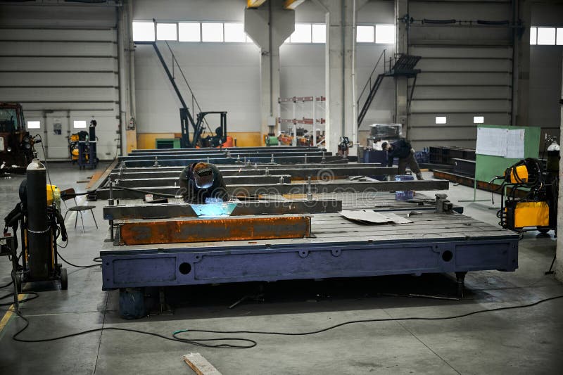 Welder during Work at Large Metal Carcass in Assembling Shop Editorial ...