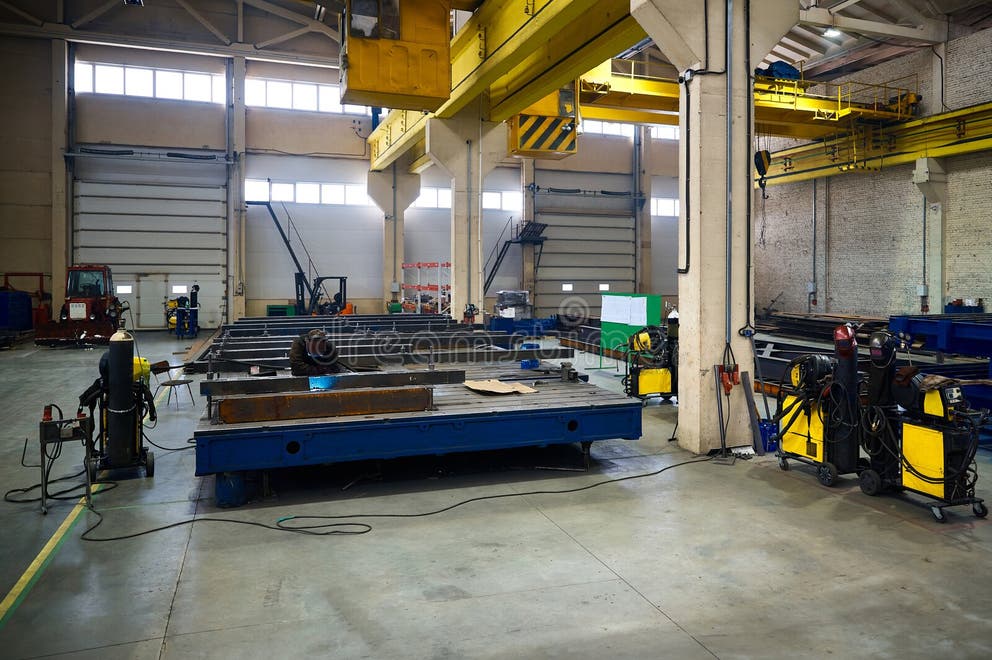 Welder during Work at Large Metal Carcass in Assembling Shop Stock ...