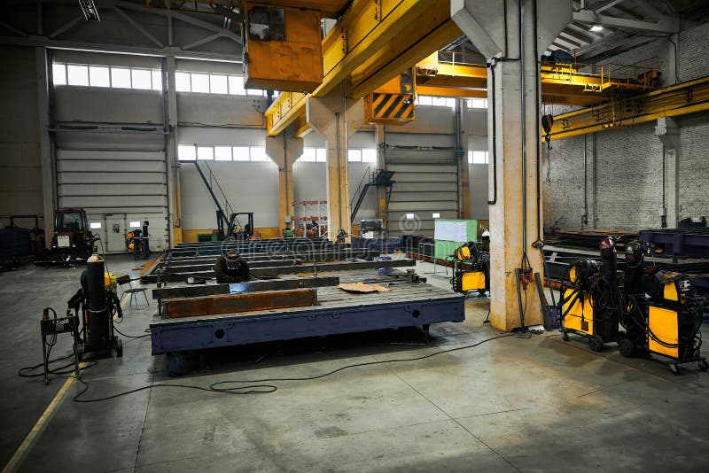 Welder during Work at Large Metal Carcass in Assembling Shop Stock ...