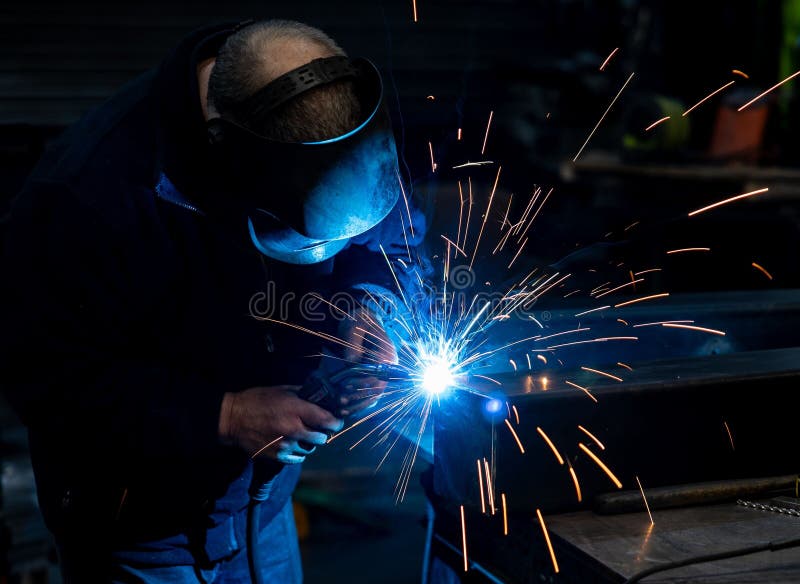 Welder at Work with Sparks in a Workshop. Stock Photo - Image of ...