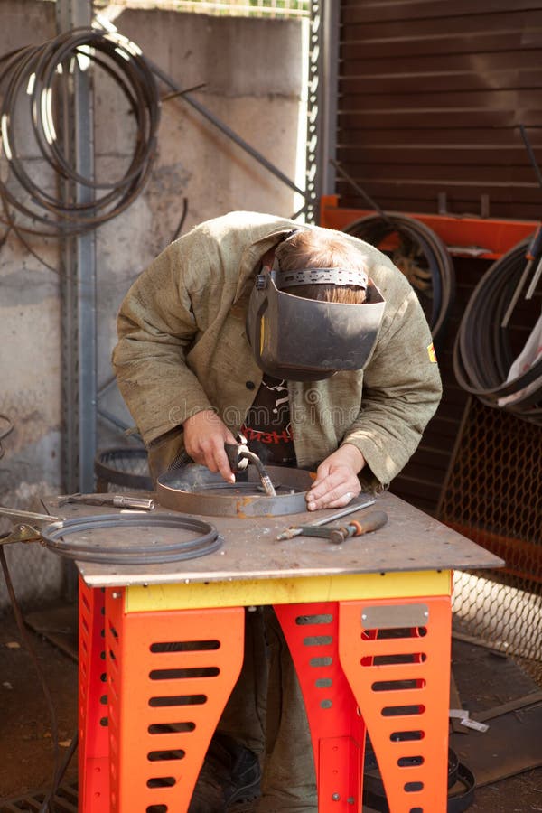 Welder at work, with iron stock photo. Image of iron - 184835068