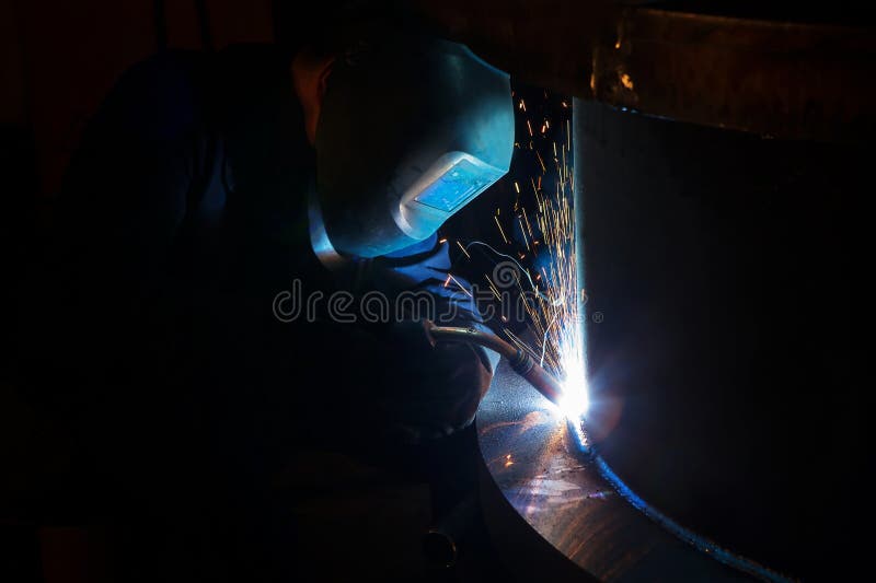 Welder worker is welding stock image. Image of flame - 63336423