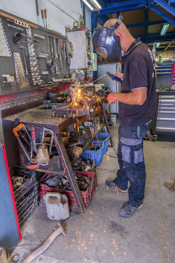Welder Working with Electric Lance in the Workshop. Stock Image - Image ...