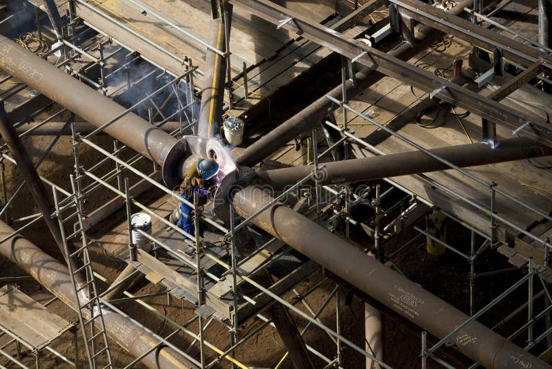 A Welder Working on a Massive Steel Jacket -the First Installed Section ...