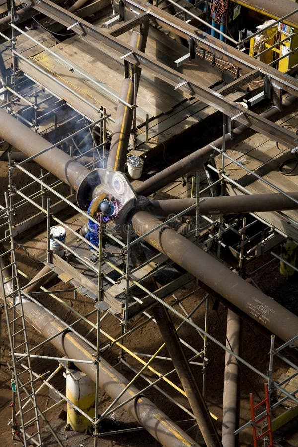 A Welder Working on a Massive Steel Jacket -the First Installed Section ...