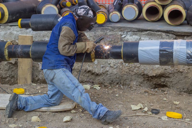 Welder Working on Pipeline Construction Stock Photo - Image of ...