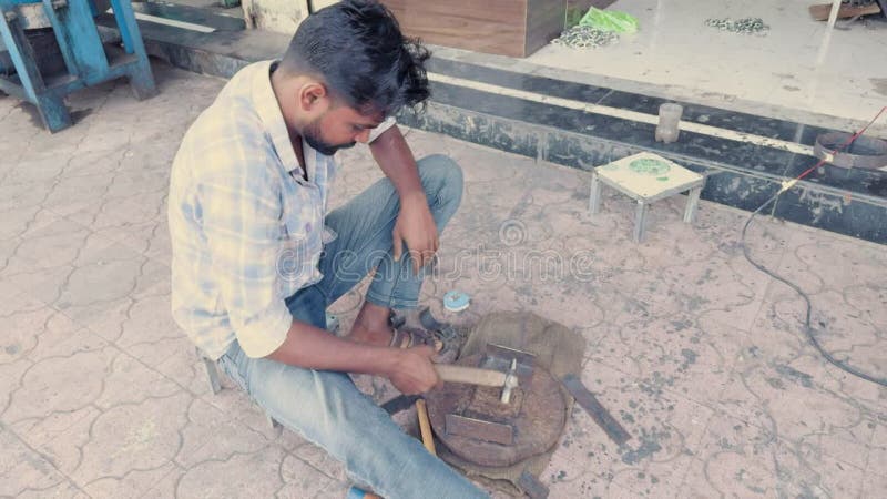 Welder Working on a Project Outdoors with Tools and Iron Angle Shaping ...