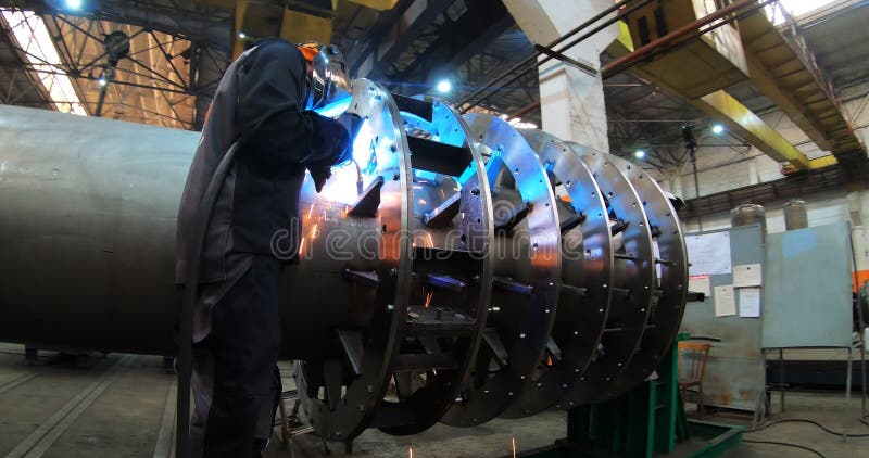 The Welder Works in the Production of Steel Structures. Stock Image ...