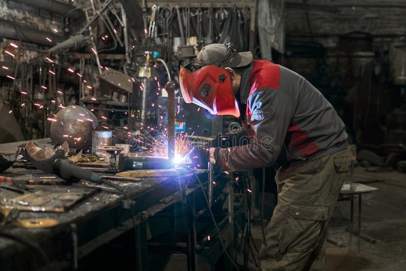 Welder In Workshop Conditions Sample Weld From Sheet Metal To Un Stock ...