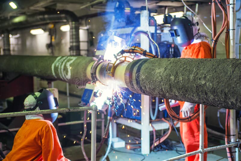 Welding two big pipes stock image. Image of industrial - 41564859