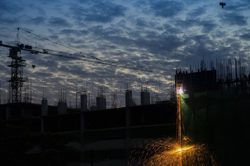 Construction Welders are Skillfully Welding Metal Beams on a High Rise ...