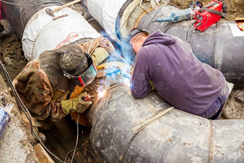 Welders Working on a Pipeline. Stock Photo - Image of seam, production ...