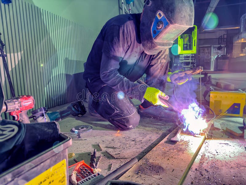 Welding with Argon or Electrode, Using a Welding Machine. Stock Photo ...