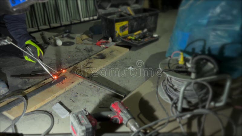 Welding with Argon or Electrode, Using a Welding Machine. Sparks and ...