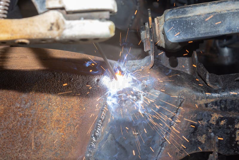 Welding Bottom Car Chassis by Electric Welding Torch on Center Frame ...
