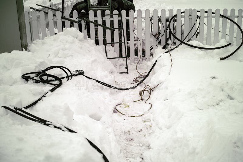 Welding cables on the snow stock image. Image of power - 317735295