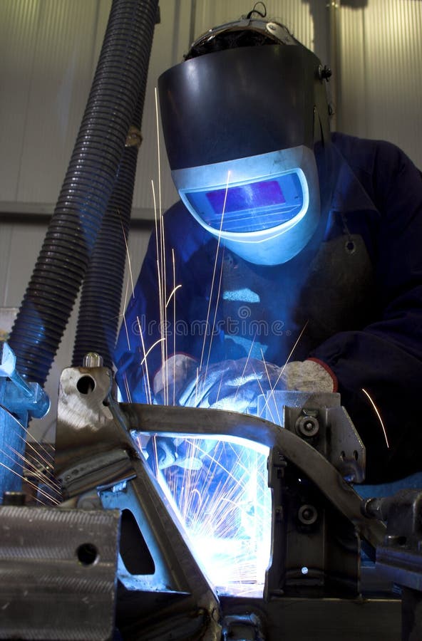 Welding a Car Part in Factory Stock Image - Image of fumes, blue: 5289675