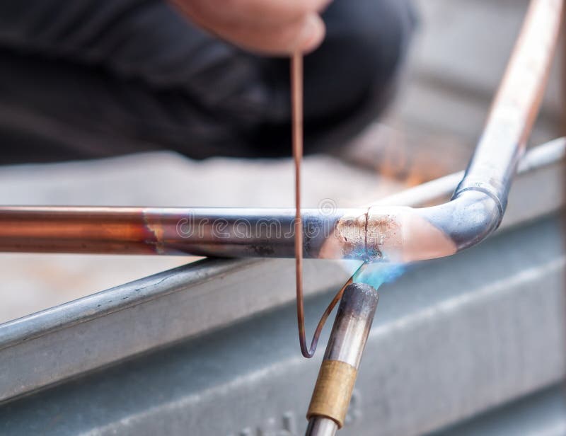 Welding of copper pipe. stock image. Image of industrial - 122623795