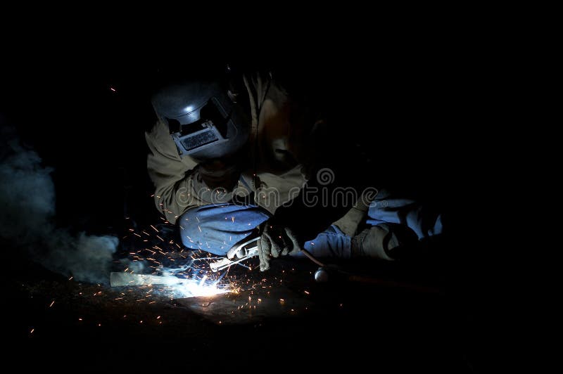 Welding in the dark stock image. Image of welding, worker - 5286303