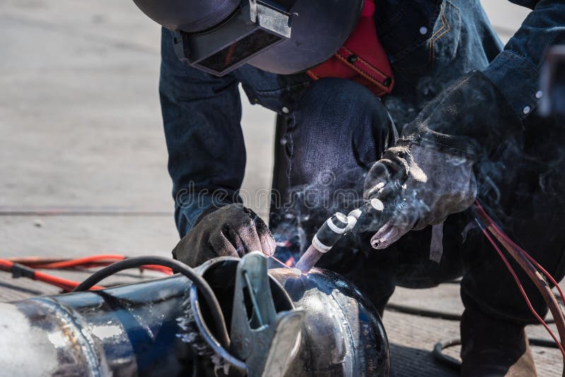 Welding in factory plant editorial photography. Image of safety - 148447272