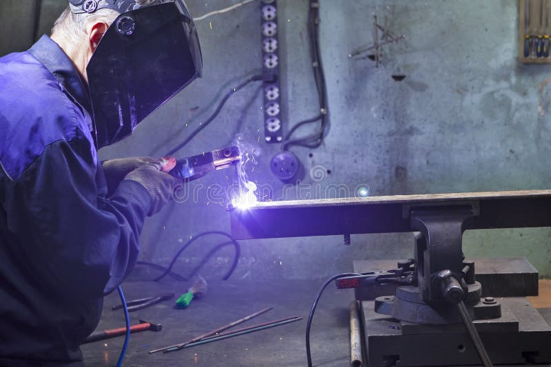 Welding Ideas. Professional Male Welder in Protective Mask during ...