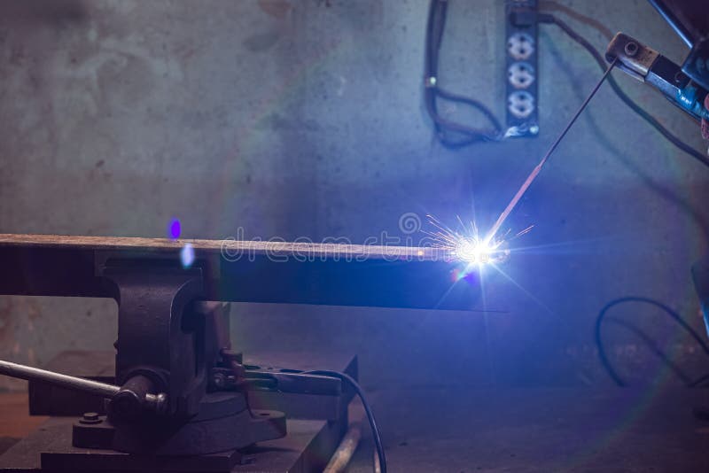 Welding Ideas. Professional Male Welder in Protective Mask during ...