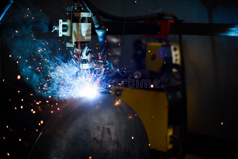 Welding Machine and Industrial Worker on the Plant. Close Up of Bright ...